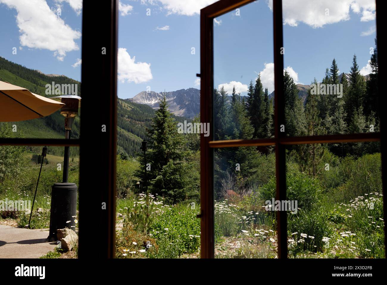 Window view to Colorado's lush landscapes and peaks Stock Photo - Alamy