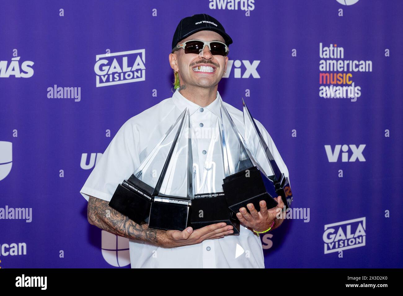 Las Vegas, USA. 25th Apr, 2024. Feid shows off his awards at the 2024 ...