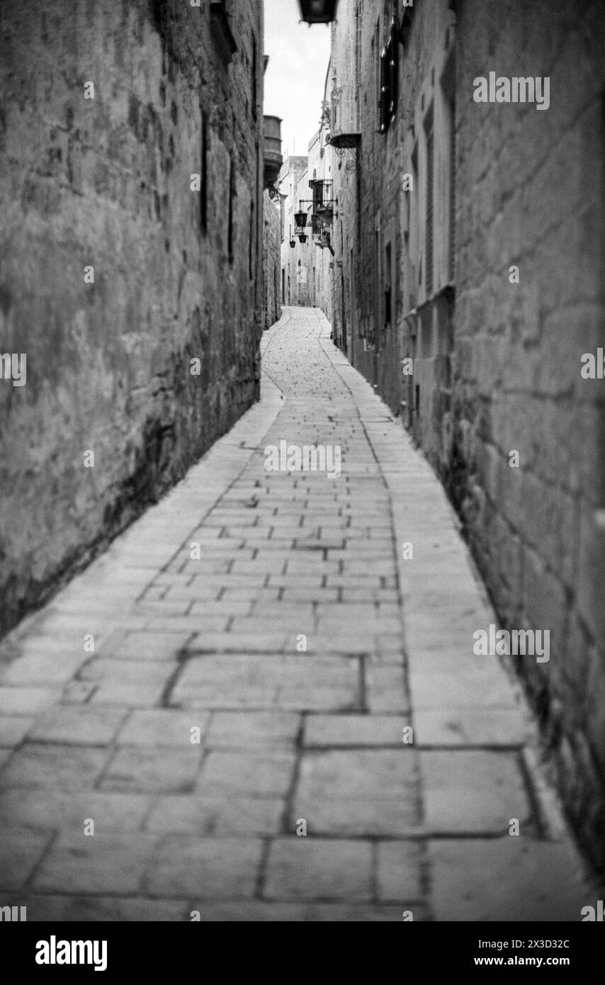 Cobbled alley through narrow streets of old city Mdina, Malta Stock ...