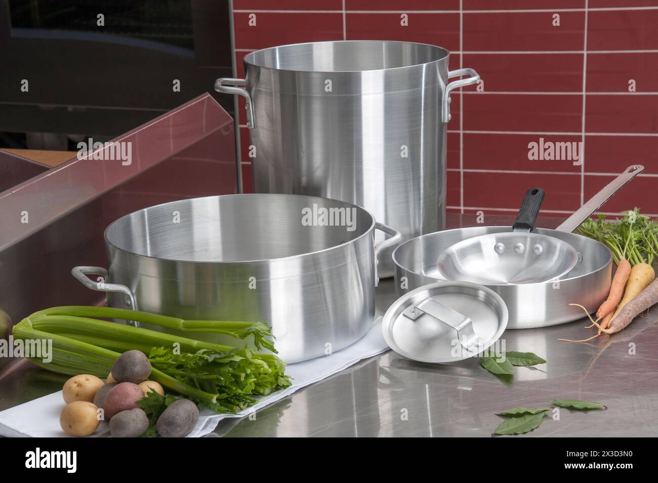 Professional aluminum cookware and fresh ingredients Stock Photo - Alamy