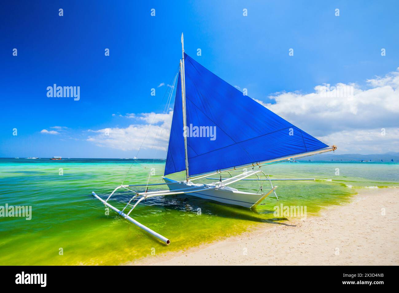 Traditional filipino boat at the idyllic white sand beach at Boracay ...