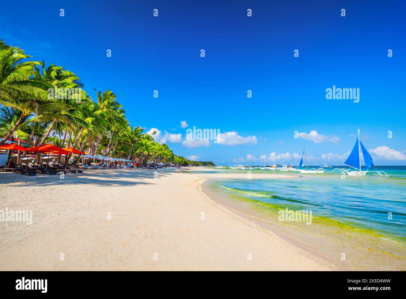 Traditional filipino boat at the idyllic white sand beach at Boracay ...