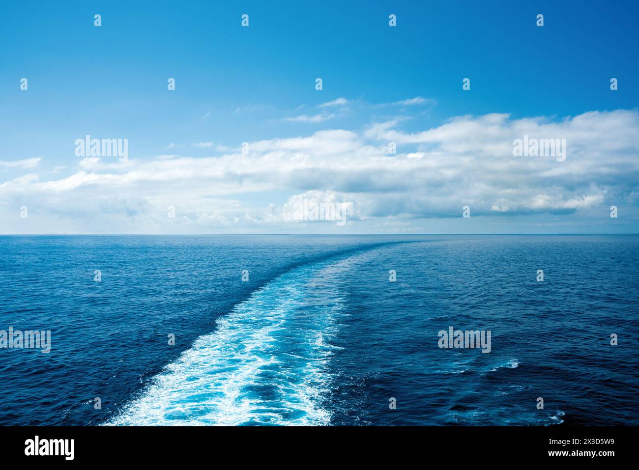 Long curved wake in the sea Stock Photo - Alamy
