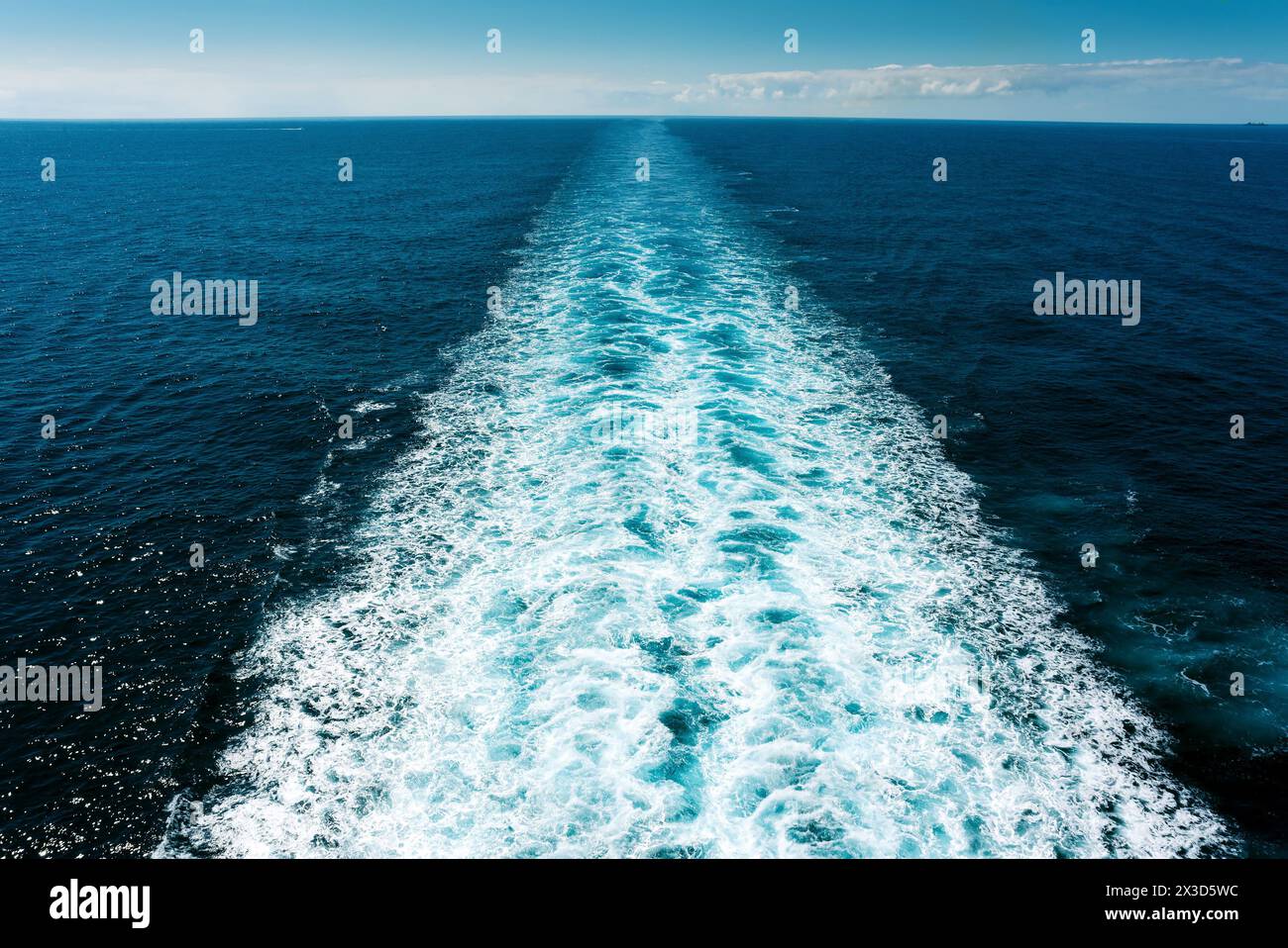 Long straight trail of a ship in the sea Stock Photo - Alamy
