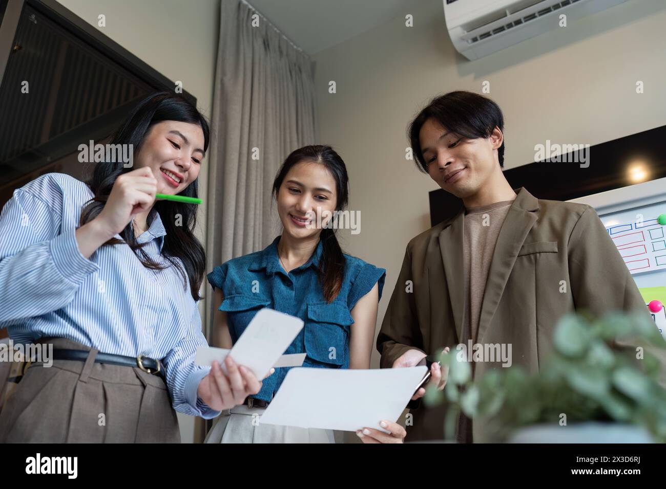 ux developer and UI designer team brainstorm together about designing application interface ...