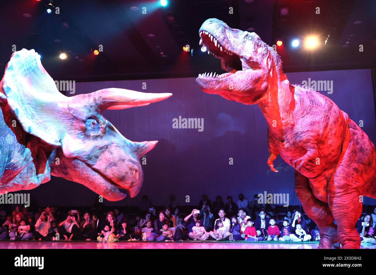 Tokyo, Japan. 26th Apr, 2024. Actors wearing dinosaur shaped mechanical ...