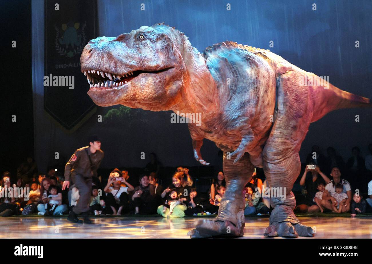 Tokyo, Japan. 26th Apr, 2024. An actor wearing dinosaur shaped ...