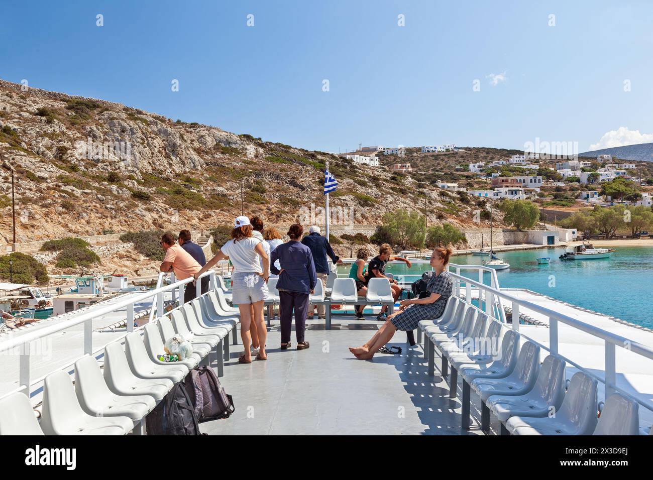 Tourists aboard legendary "Skopelitis" ferry, arriving at the port of ...