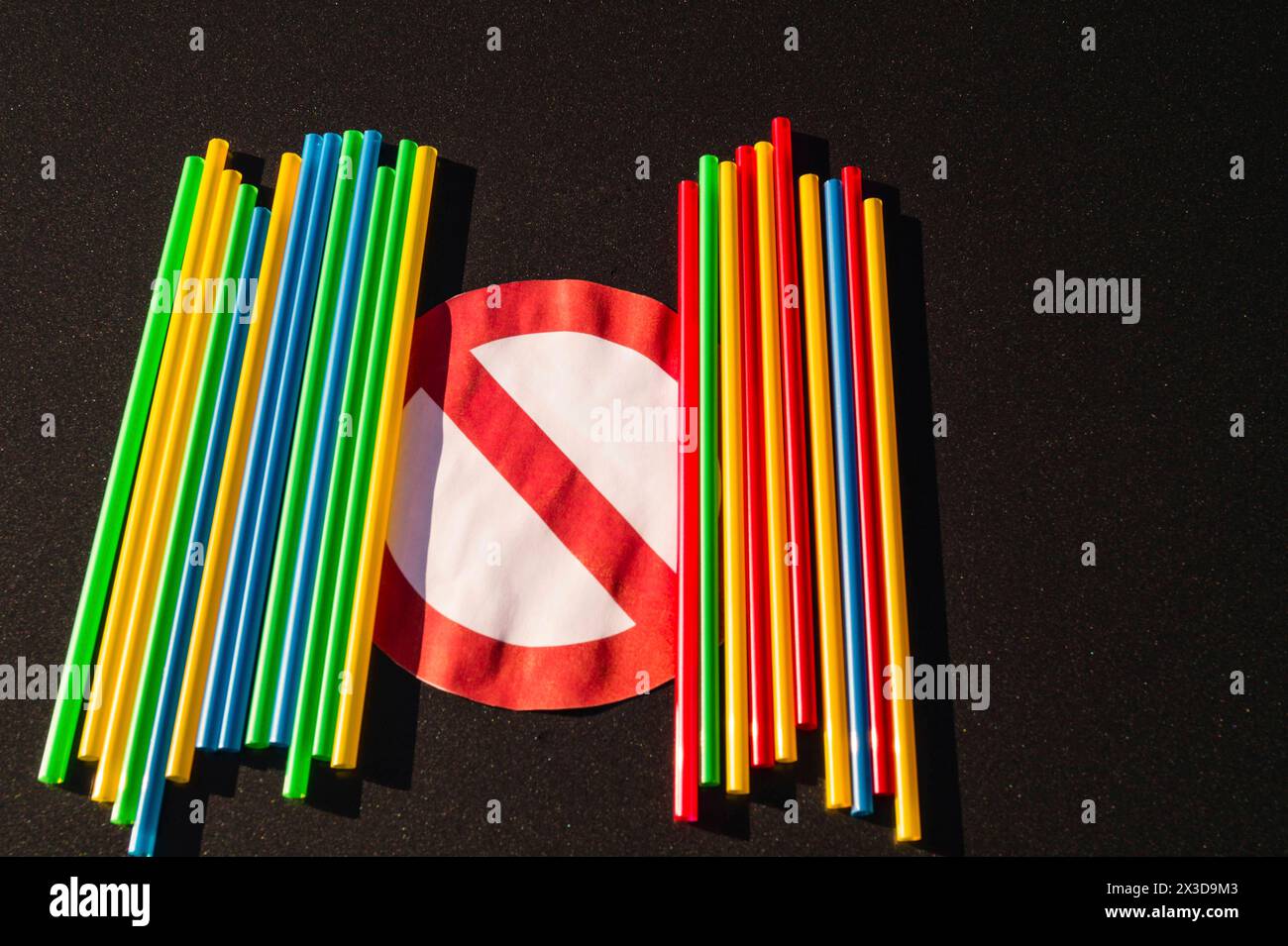 colorful plastic straws with probibition sign Stock Photo - Alamy