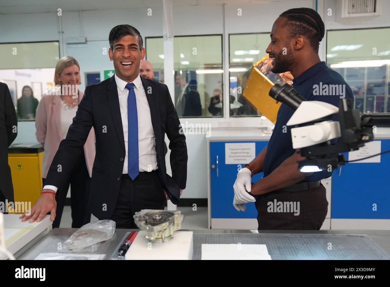 Prime Minister Rishi Sunak (left) talking to a apprentice during a ...