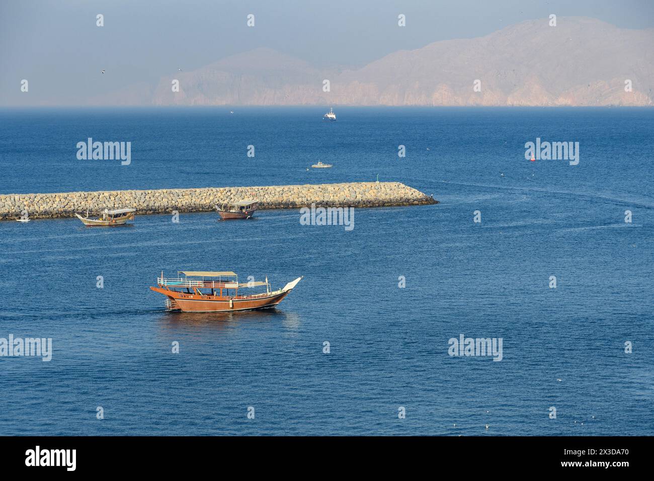 A serene moment captured at Hasaba Harbor, where the calm blue waters ...