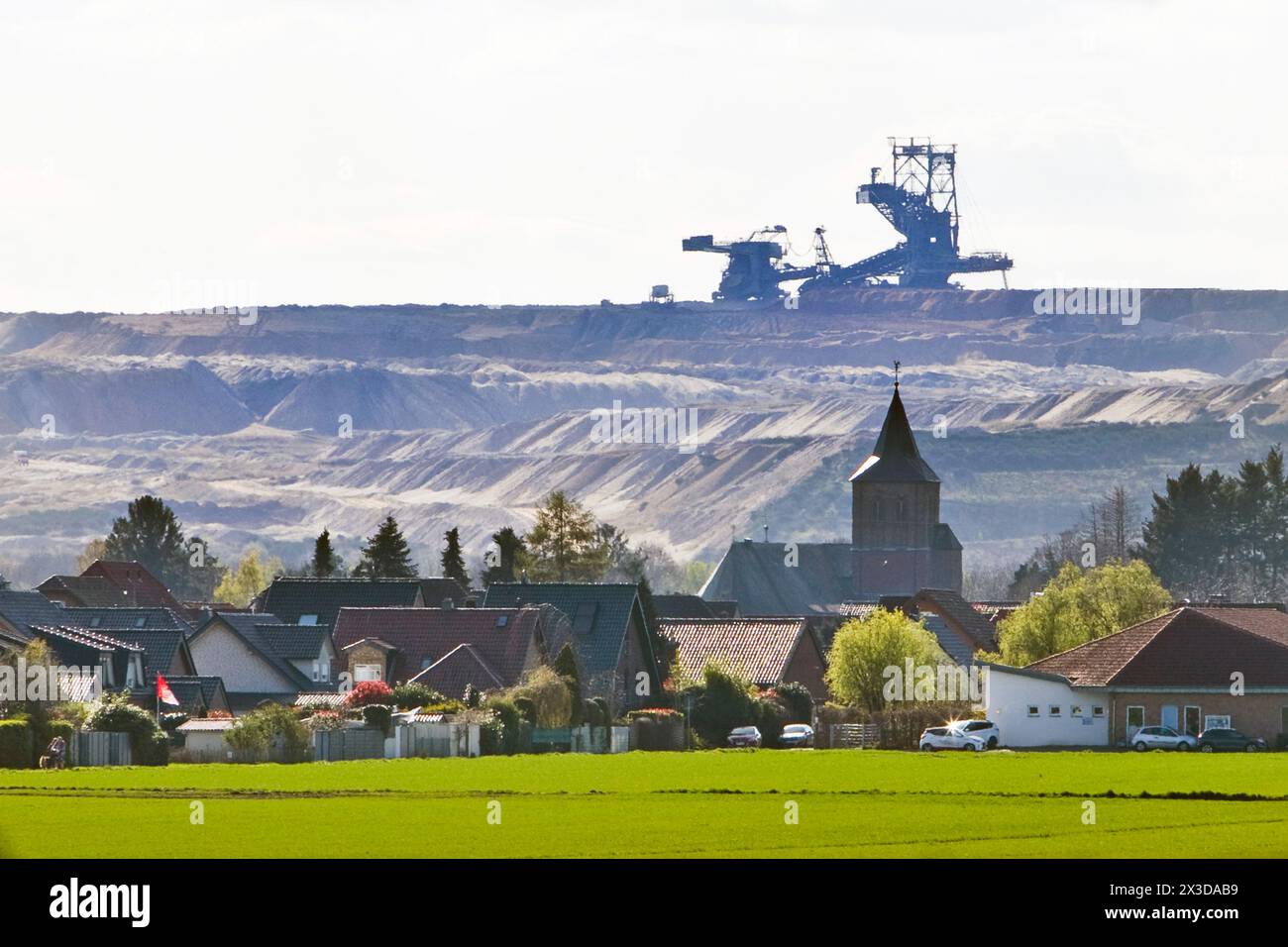 Hambach opencast mine with spreader in front of St. Laurentius Church ...
