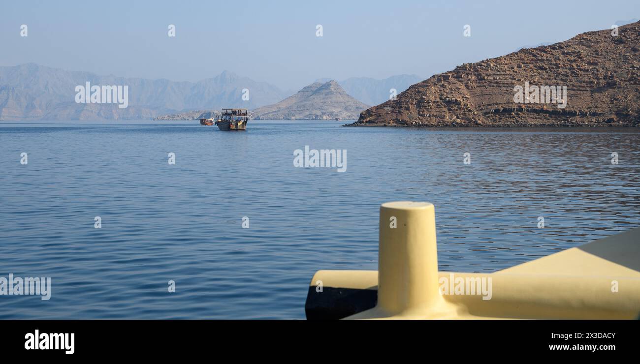 A caravan of traditional excursion boats peacefully navigates the calm ...