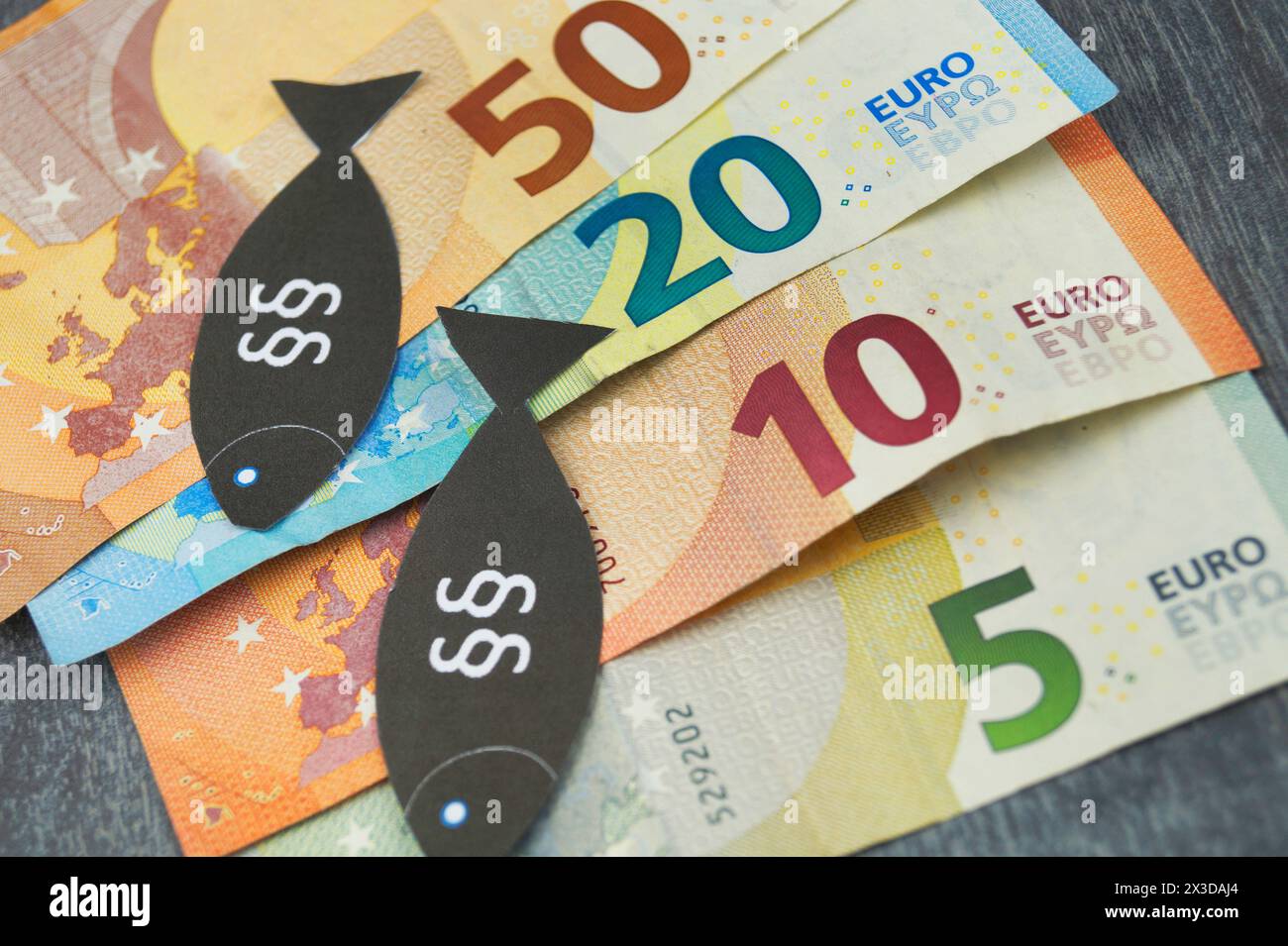 fish shapes with paragraphs and money, symbol for fishing quota Stock ...