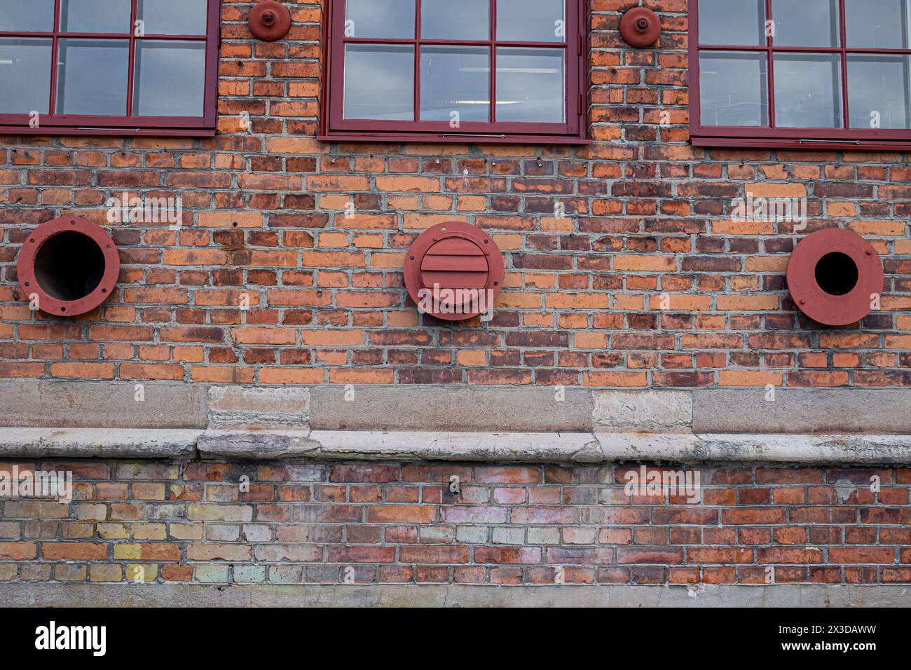 Ventilation pipes and vents coming out of a brick facade Stock Photo ...
