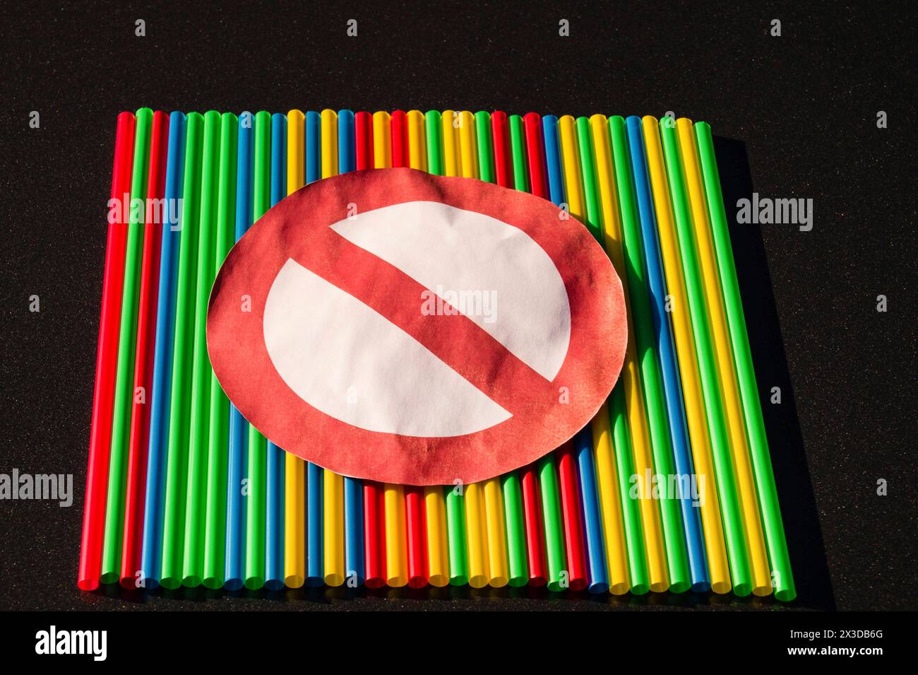 colorful plastic straws with probibition sign Stock Photo - Alamy