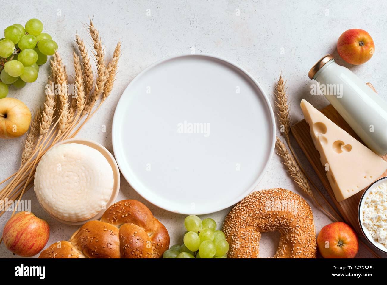 Religious Jewish holiday Shavuot background with dairy products, cheese ...