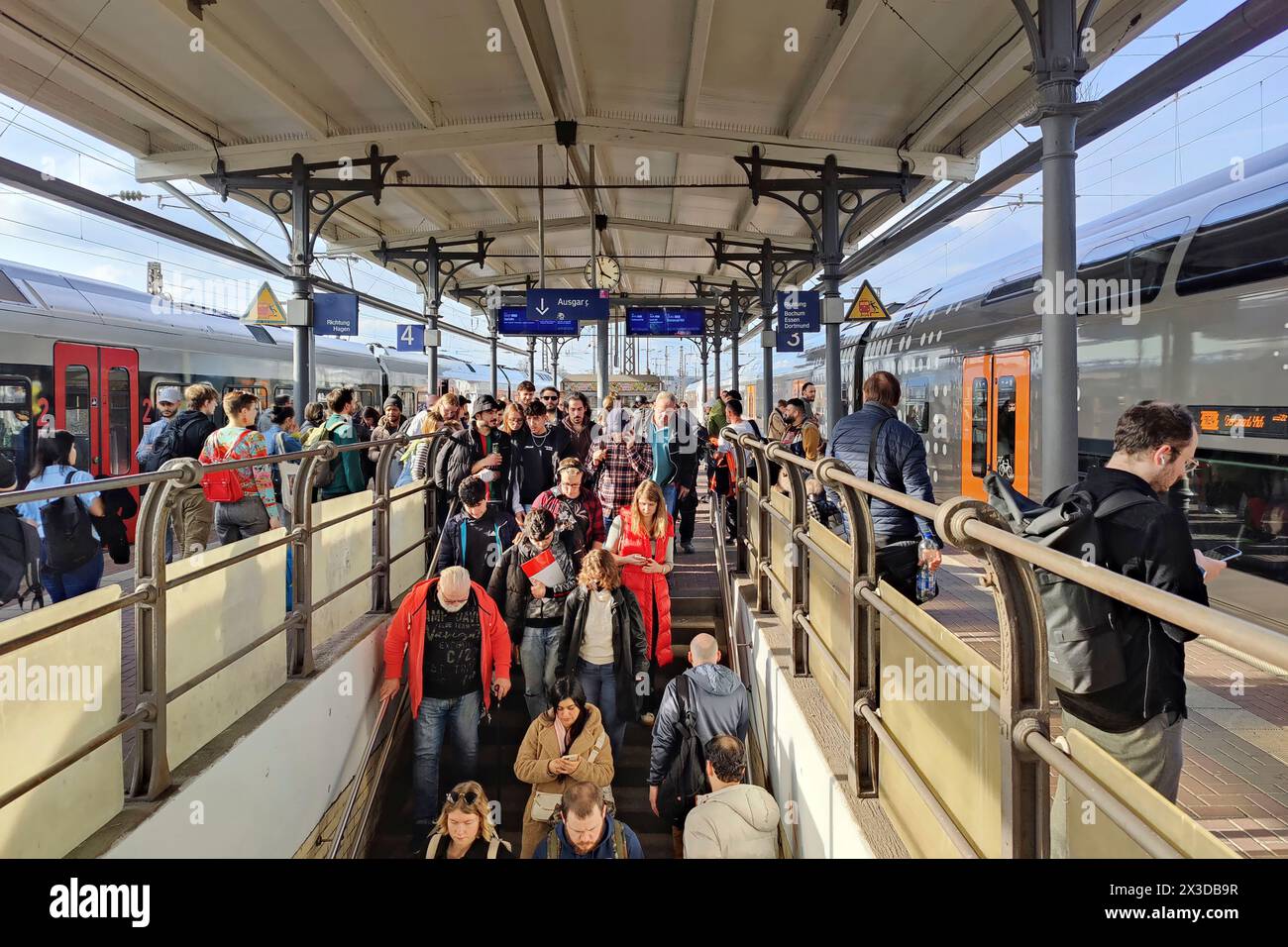Lots of people and two local trains at the main station, Germany, North ...