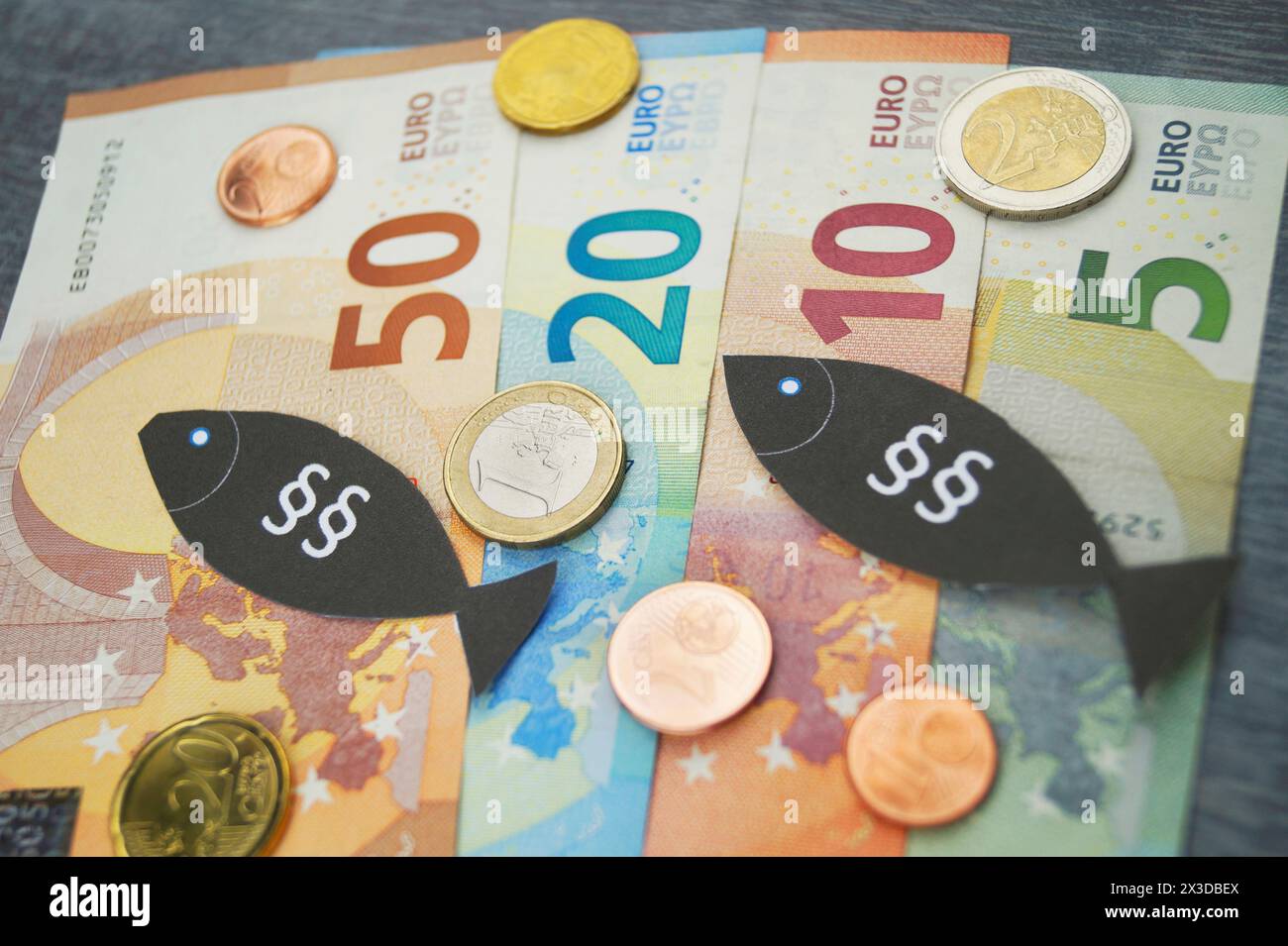 fish shapes with paragraphs and money, symbol for fishing quota Stock ...