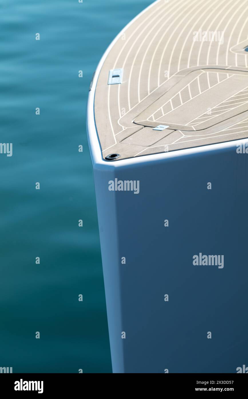 The bow of a beautiful powerboat with nice clean lines showing the deck ...