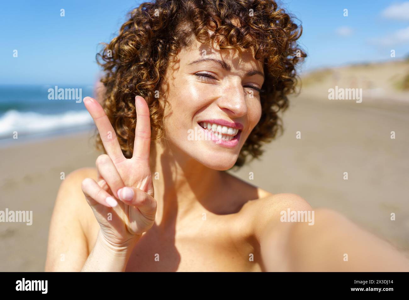 Woman showing victory fingers hi-res stock photography and images - Alamy