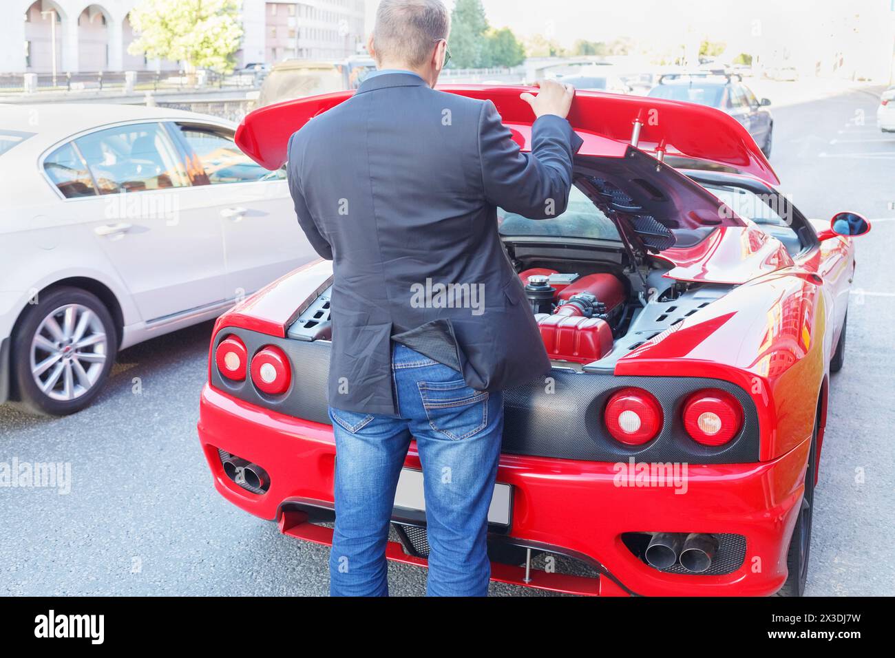 MOSCOW, RUSSIA - JUN 22, 2016: Successful businessman (with model ...