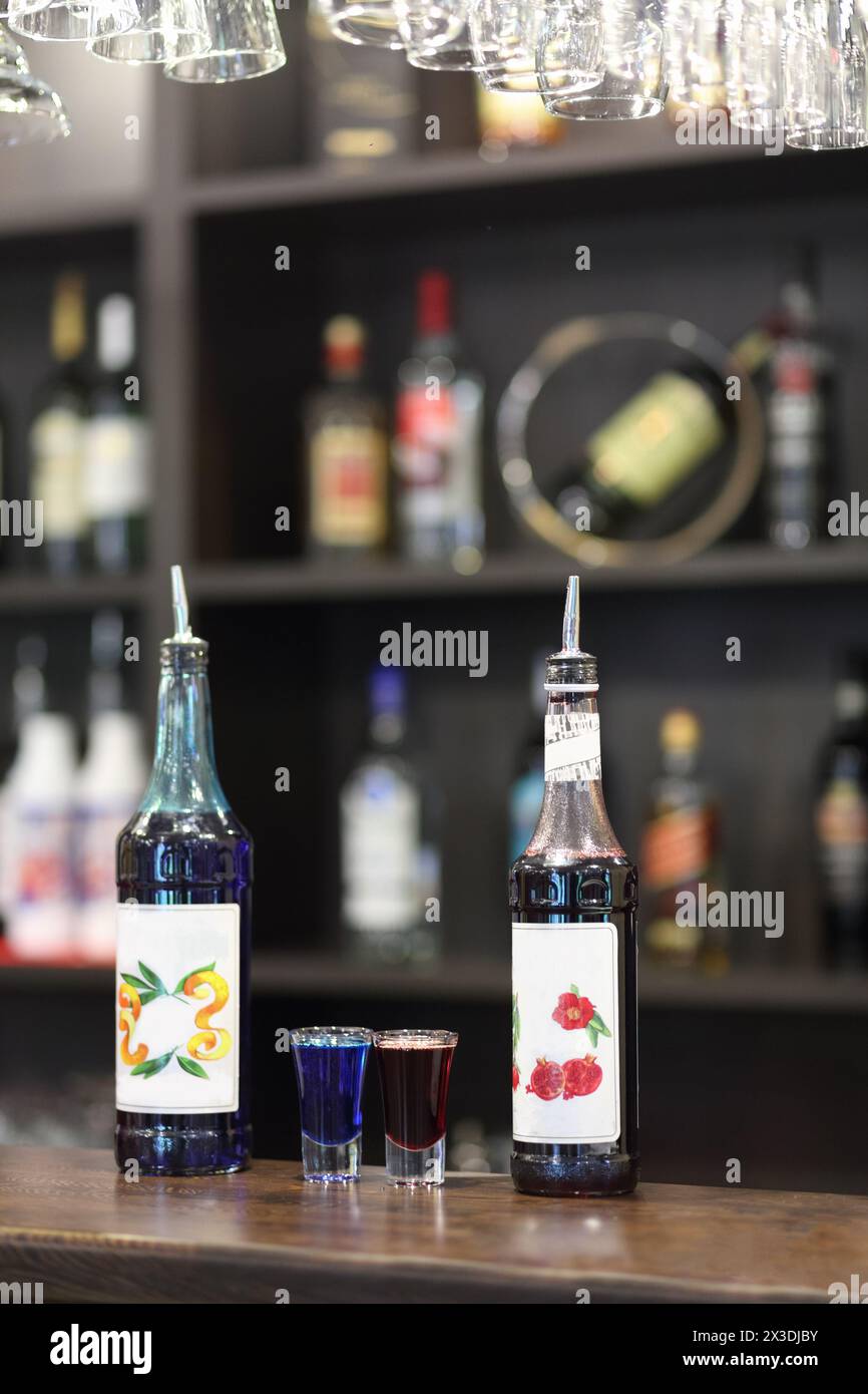 Bottles of syrup for making coctail on Bar counter in night club Stock ...