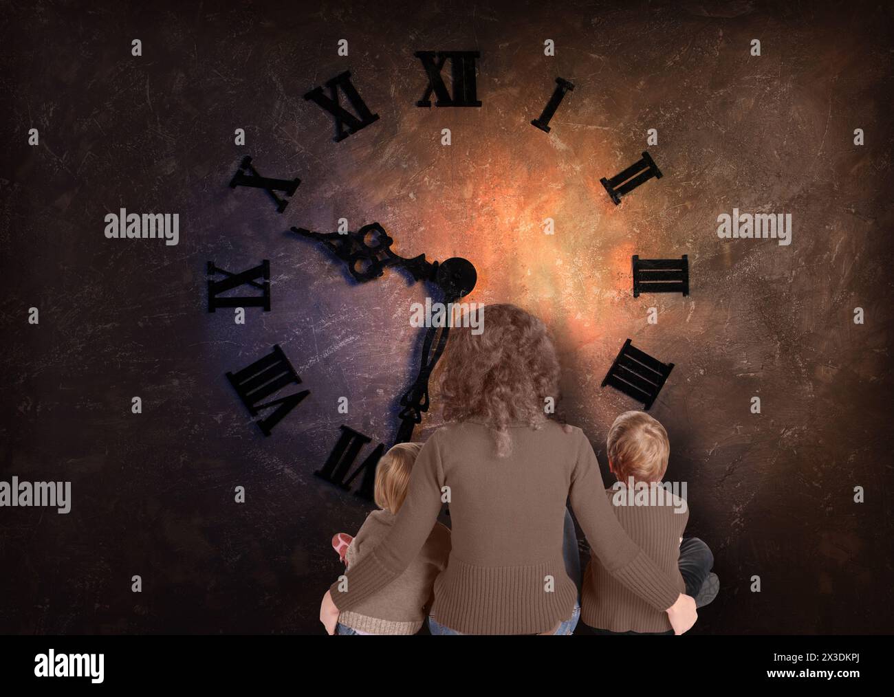 Mother with her son and daughter are sitting opposite wall with big ...