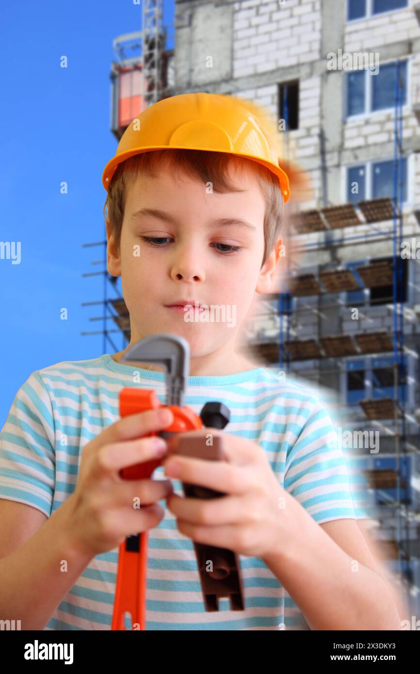 Collage with boy in plastic helmet with toy tools against background of ...