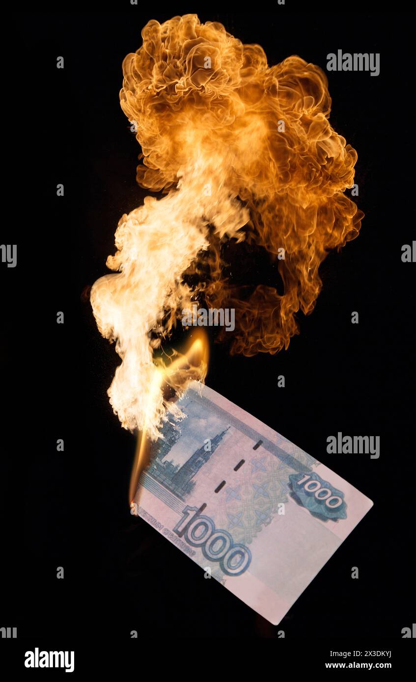 Collage with burning thousand-ruble note and big flame on black ...