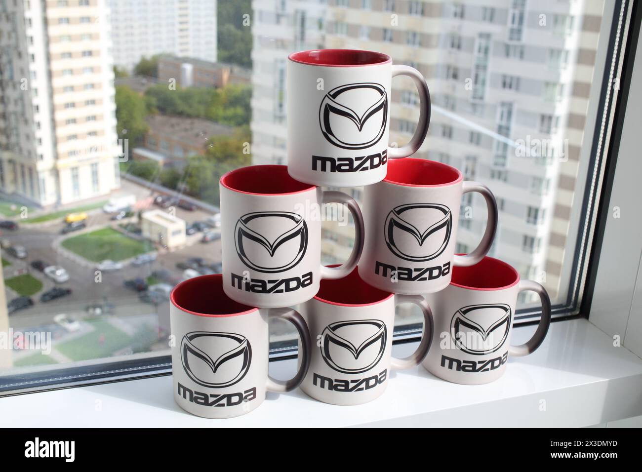 MOSCOW - AUG 29, 2016: Pyramid of six white cups with the logo on the ...