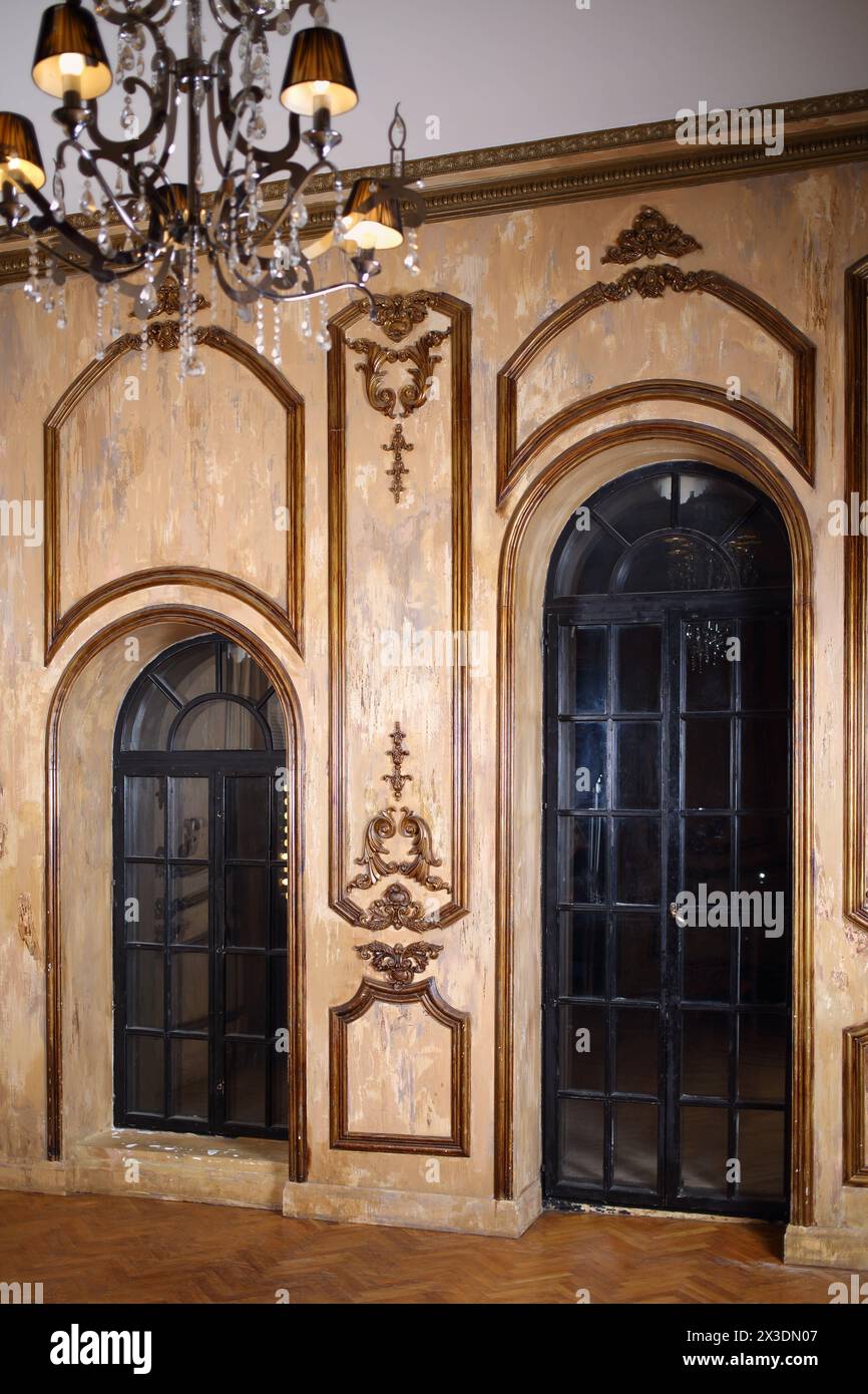 Interior of the old room in the shabby style with black arched windows ...