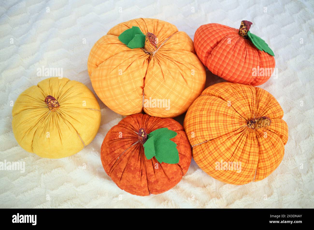 Five textile orange pumpkins Stock Photo - Alamy