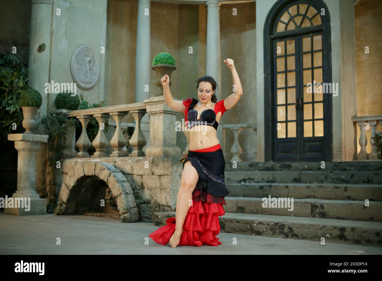 Belly dancing in red dress hi-res stock photography and images - Alamy
