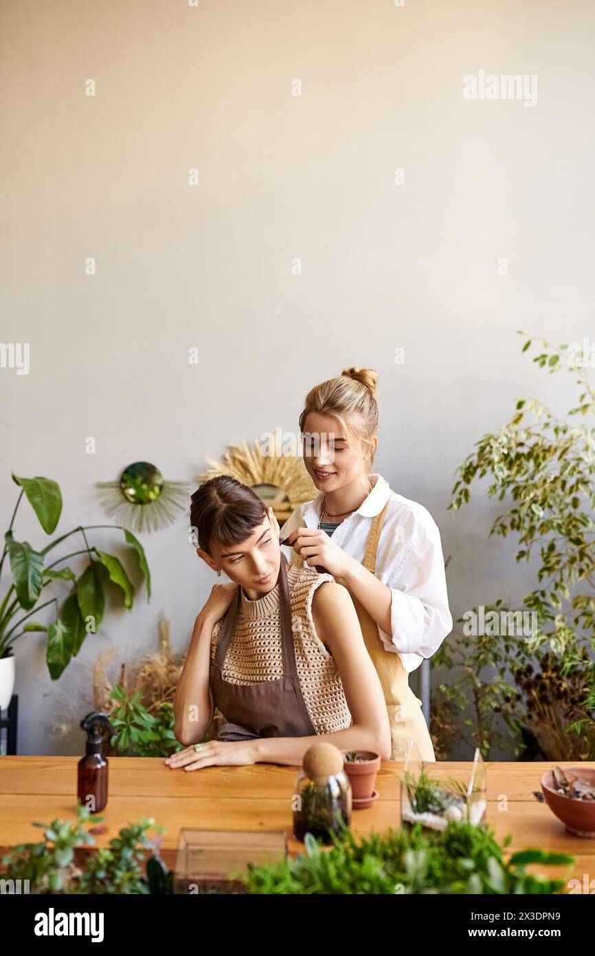 Two women enjoy art at a table Stock Photo - Alamy