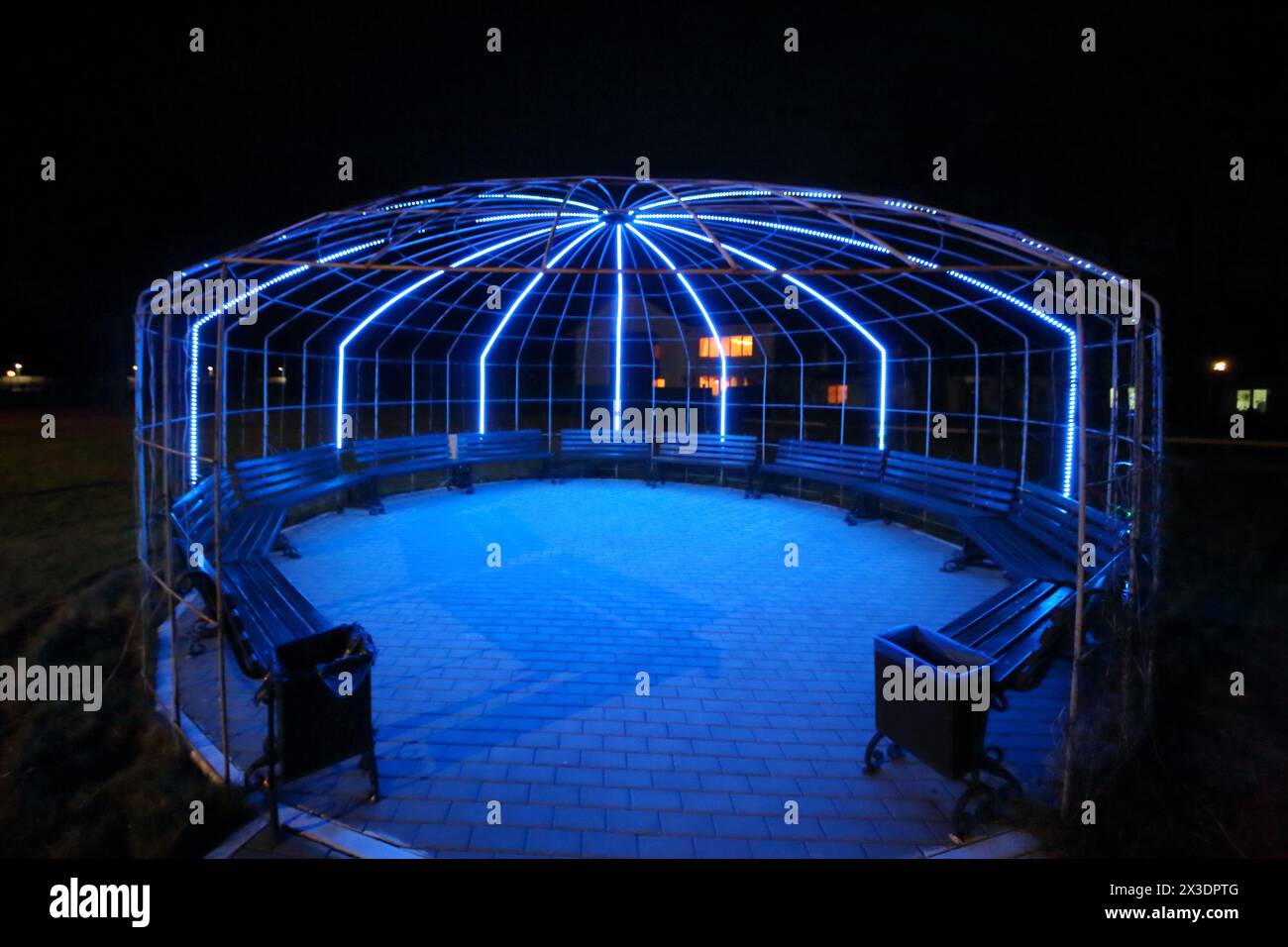 Large metal arbor with blue backlight in the evening Stock Photo - Alamy