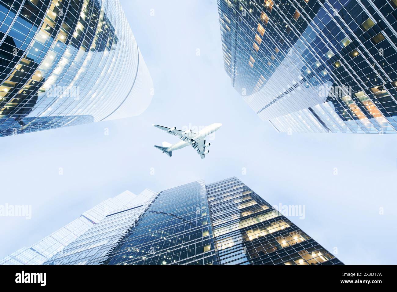 Plane flying past skyscrapers hi-res stock photography and images - Alamy