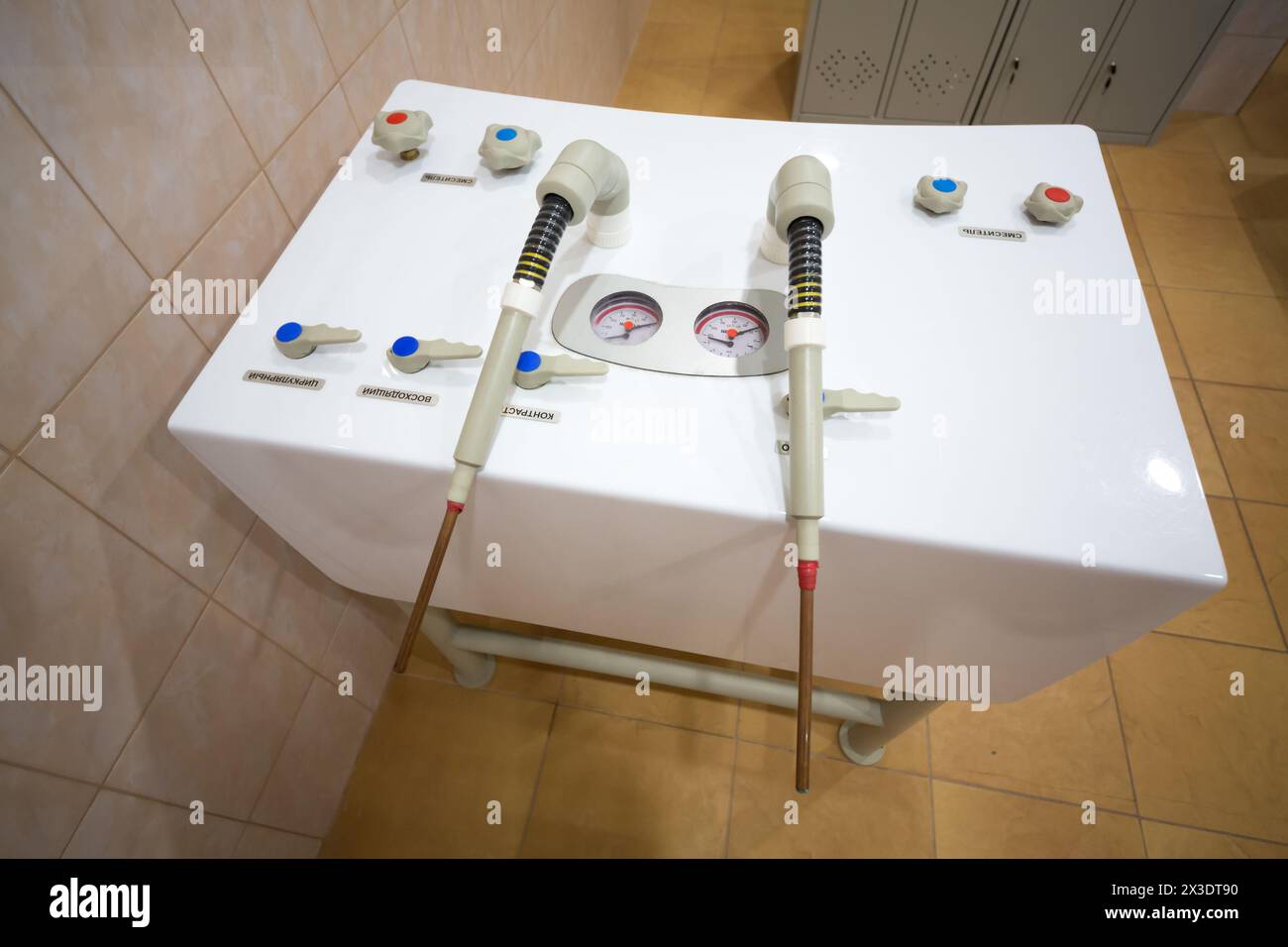 Empty room with the white equipment for a contrast shower hydrotherapy ...