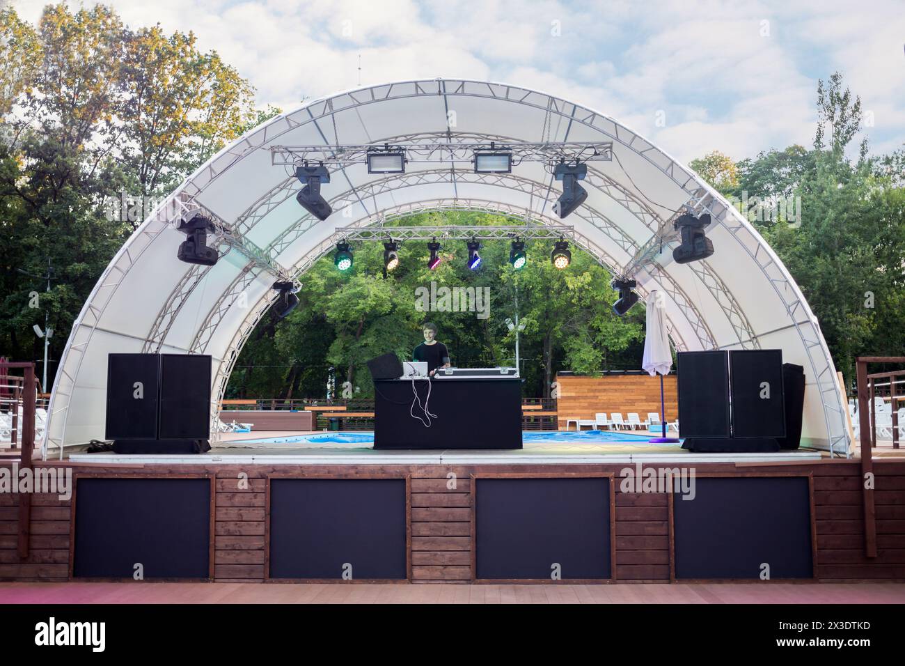 Empty outdoor dance flloor with young DJ and color lightspots Stock ...