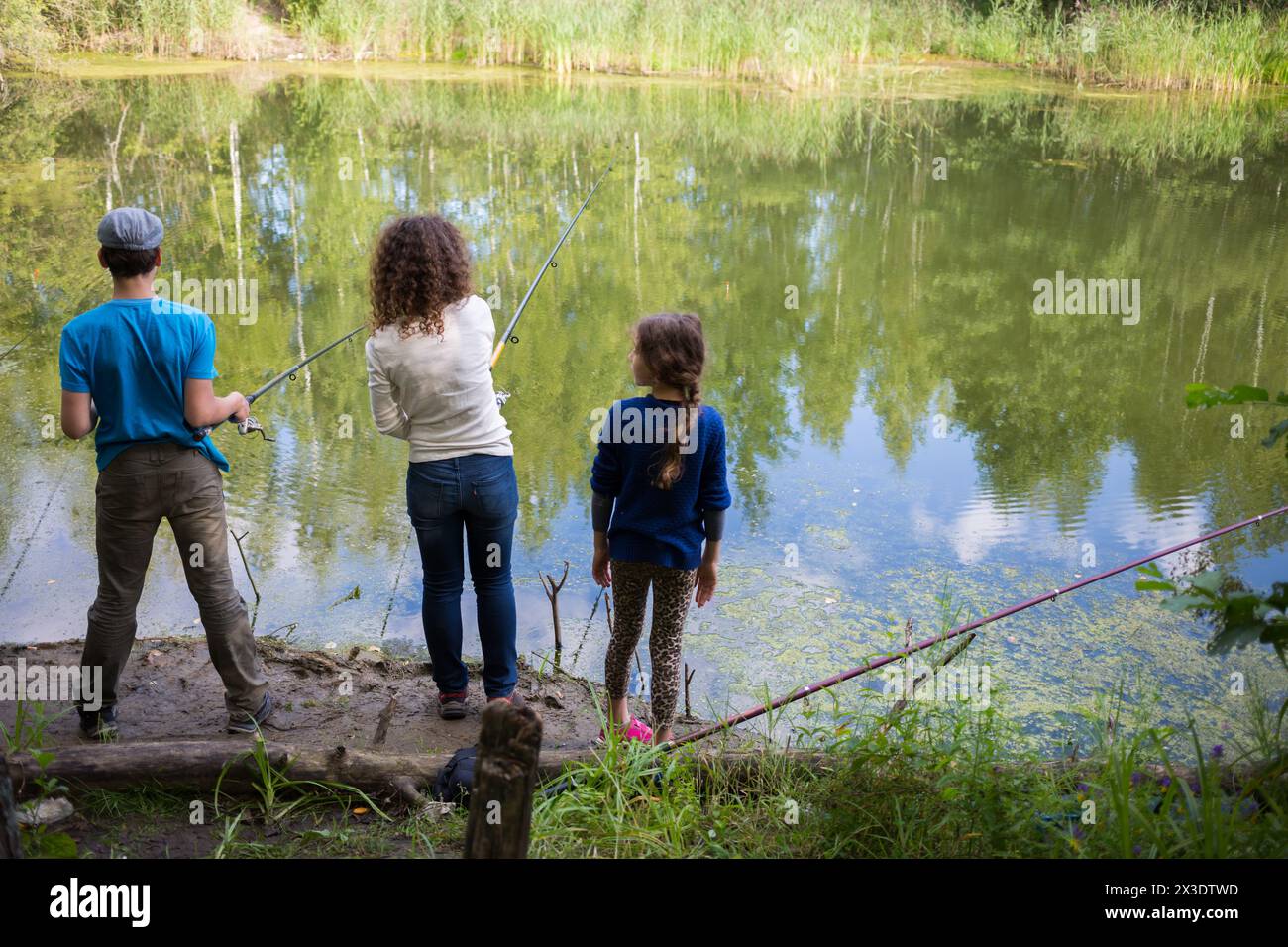 Young woman fishing pond in hi-res stock photography and images - Alamy