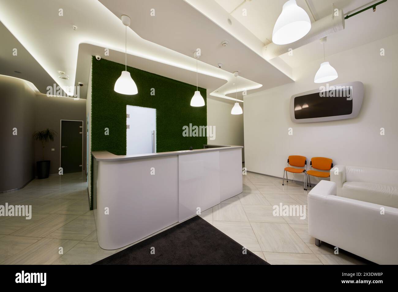 Interior of modern reception hall with front desk and sofas Stock Photo ...