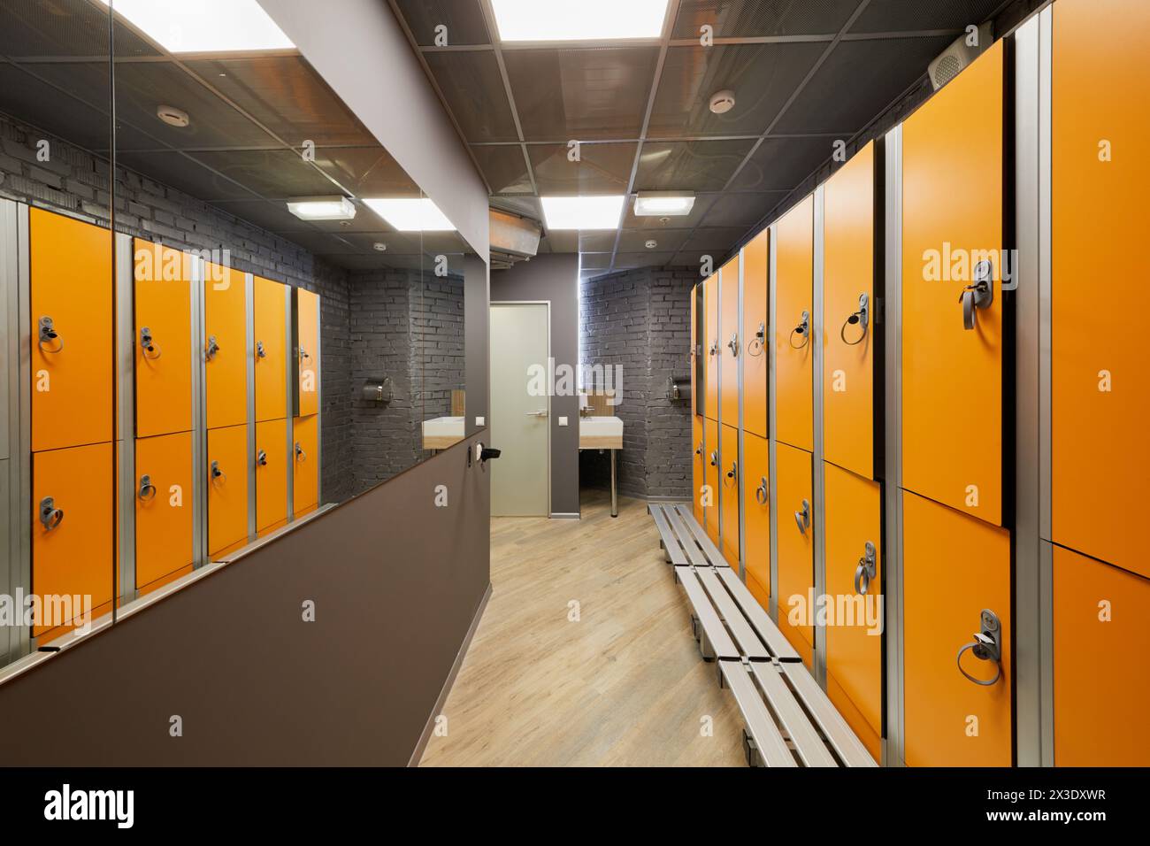 Orange lockers in locker room in sports club Stock Photo - Alamy