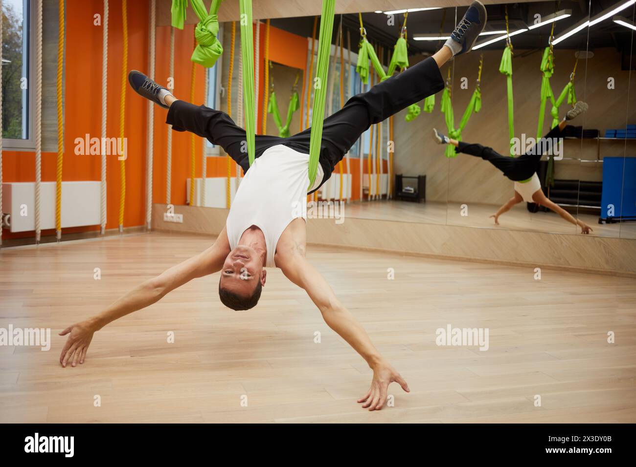 Male athlete doing rope climb hi-res stock photography and images - Alamy