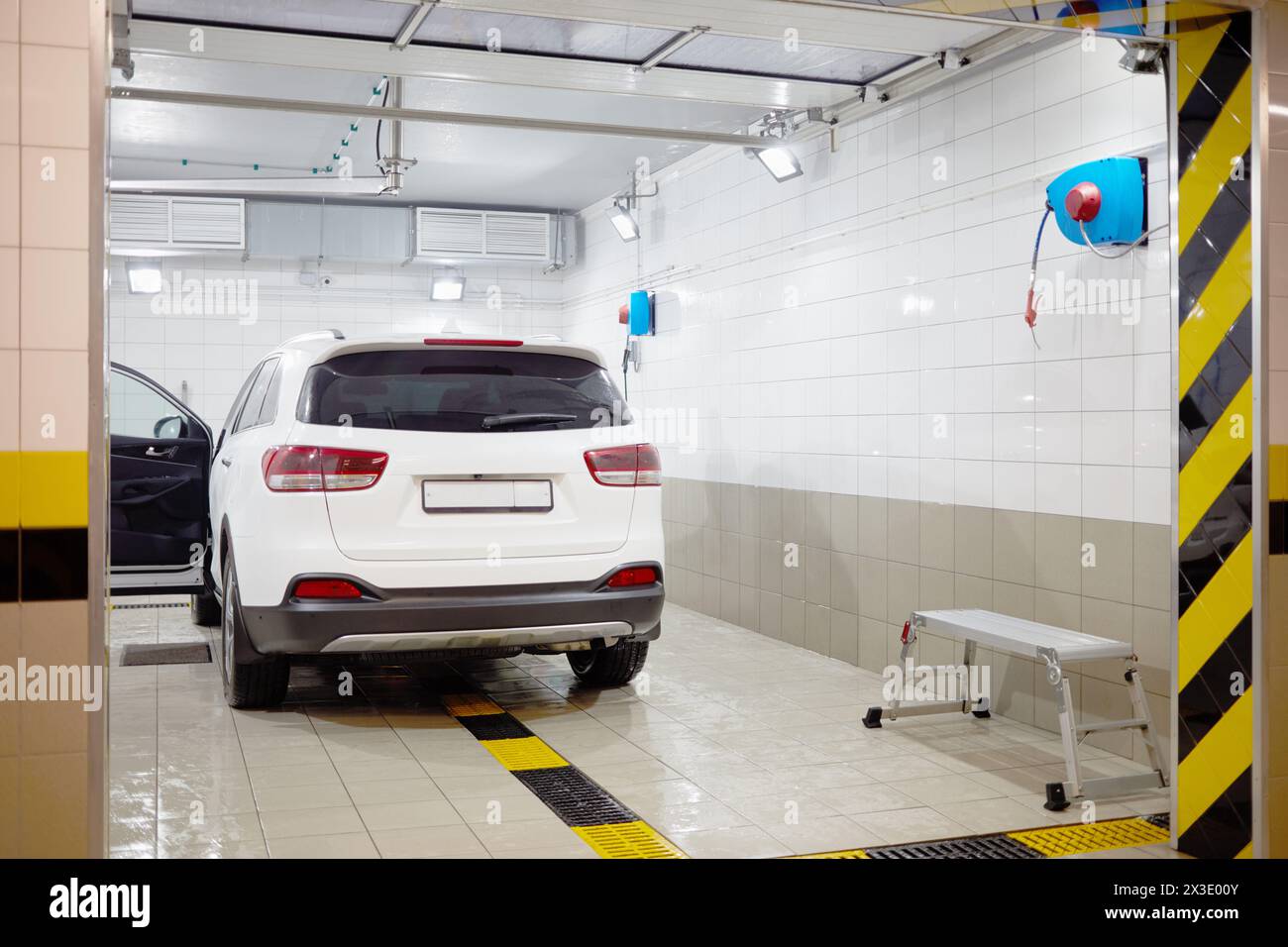 White modern car in cleaning box at underground parking Stock Photo - Alamy