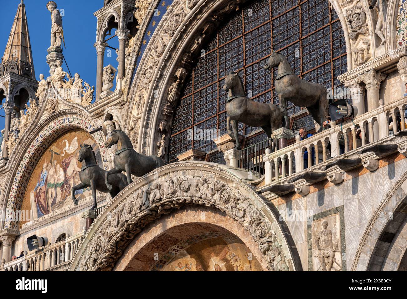 Four gilded bronze horses of St. Mark Basilica (Basilica di San Marco) in Venice, Italy. Located ...