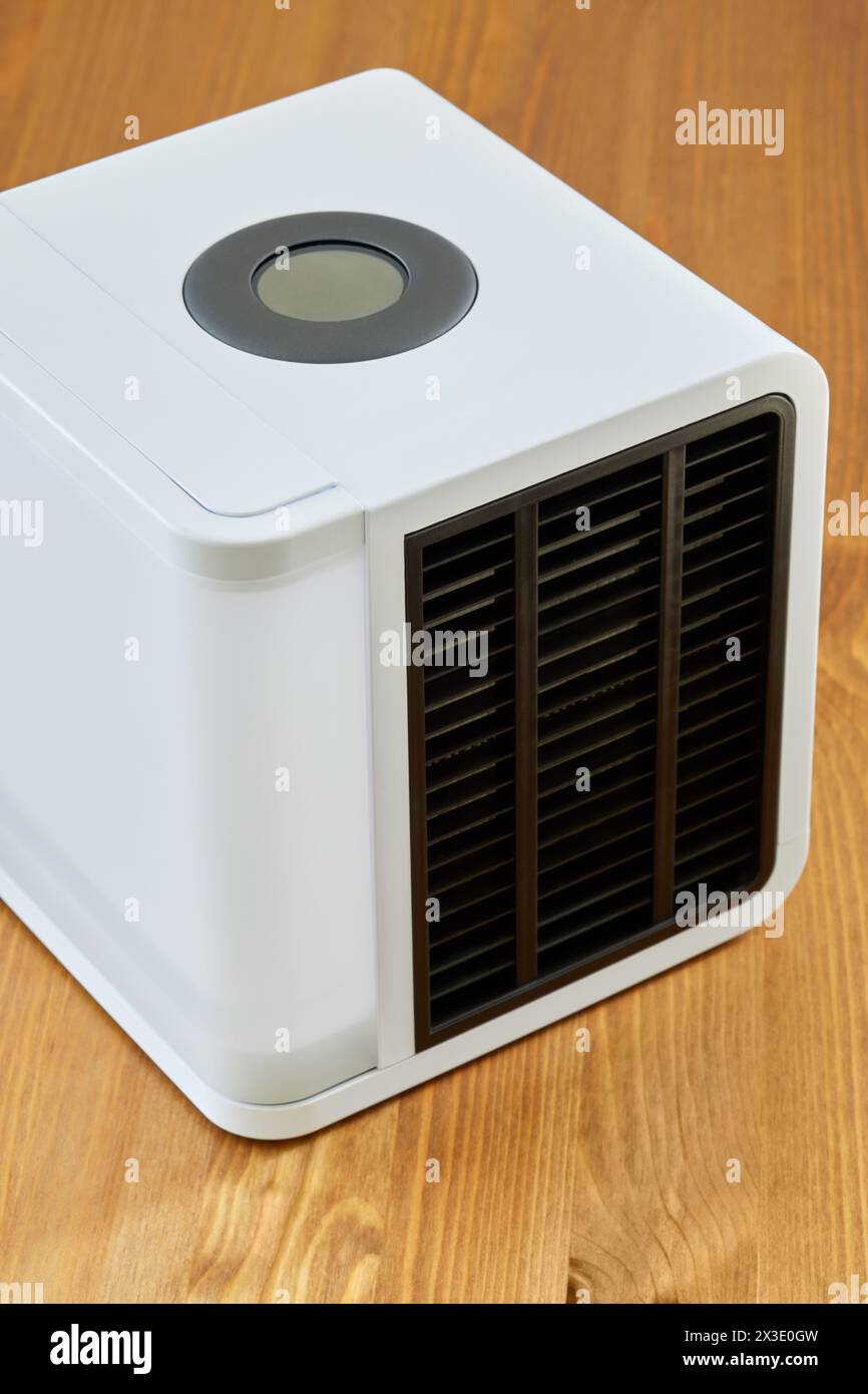 Small non-electrical air cooler humidifier on table Stock Photo - Alamy