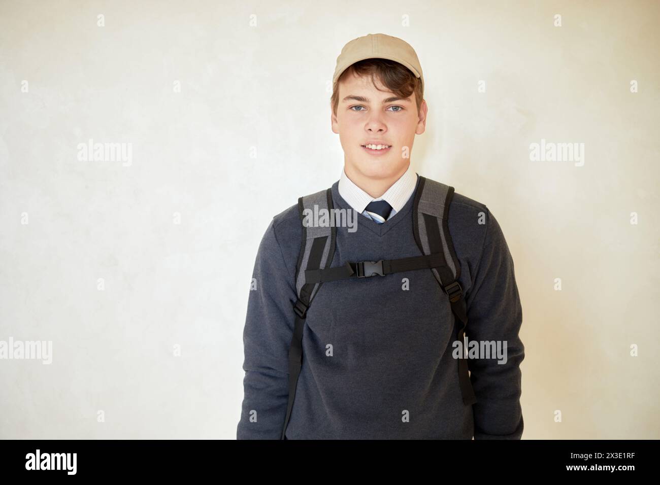 Portrait of smiling schoolboy in cap with rucksack Stock Photo - Alamy