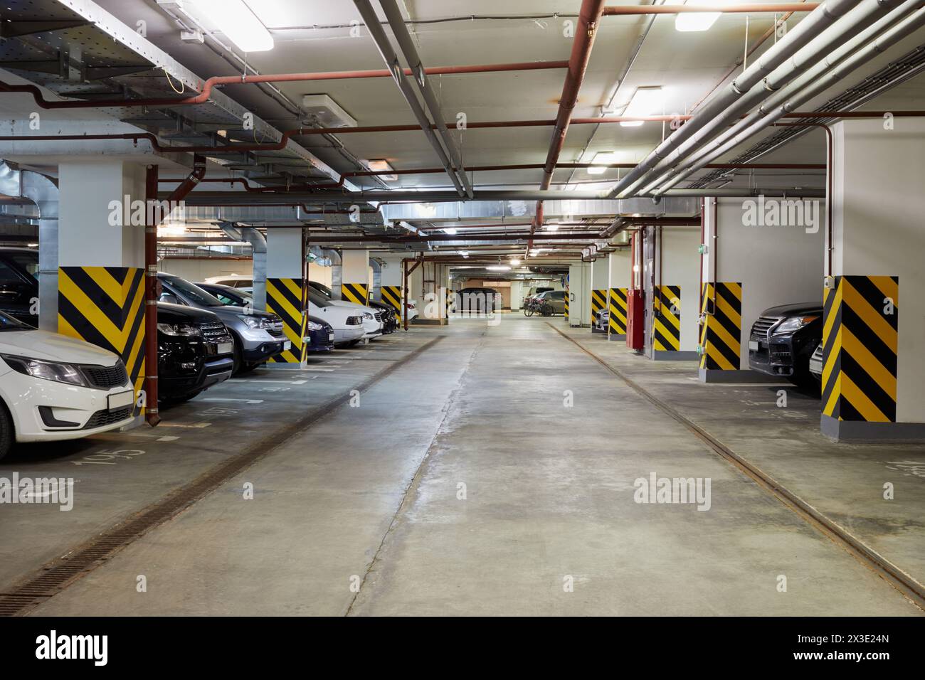 Underground parking with parked cars Stock Photo - Alamy
