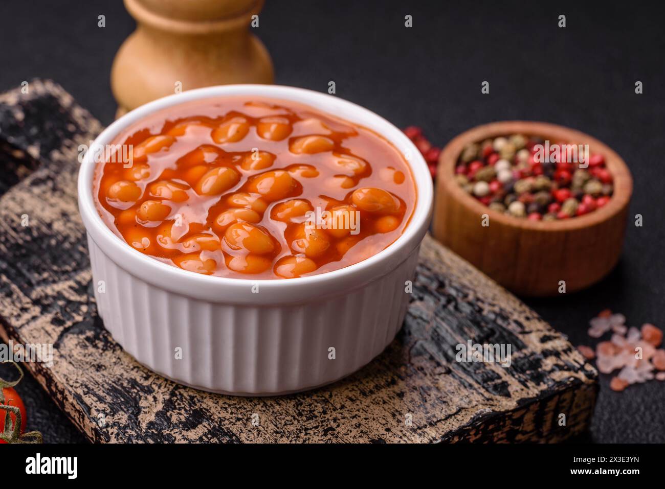Delicious nutritious canned beans in tomato, with salt and spices as a ...