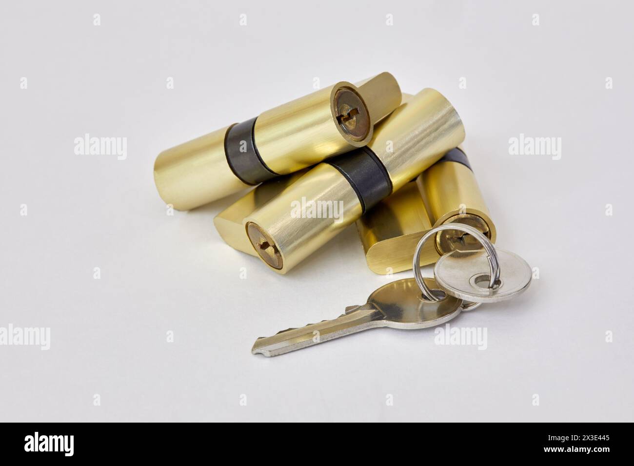 Three pin tumbler locks and keys on white background Stock Photo - Alamy